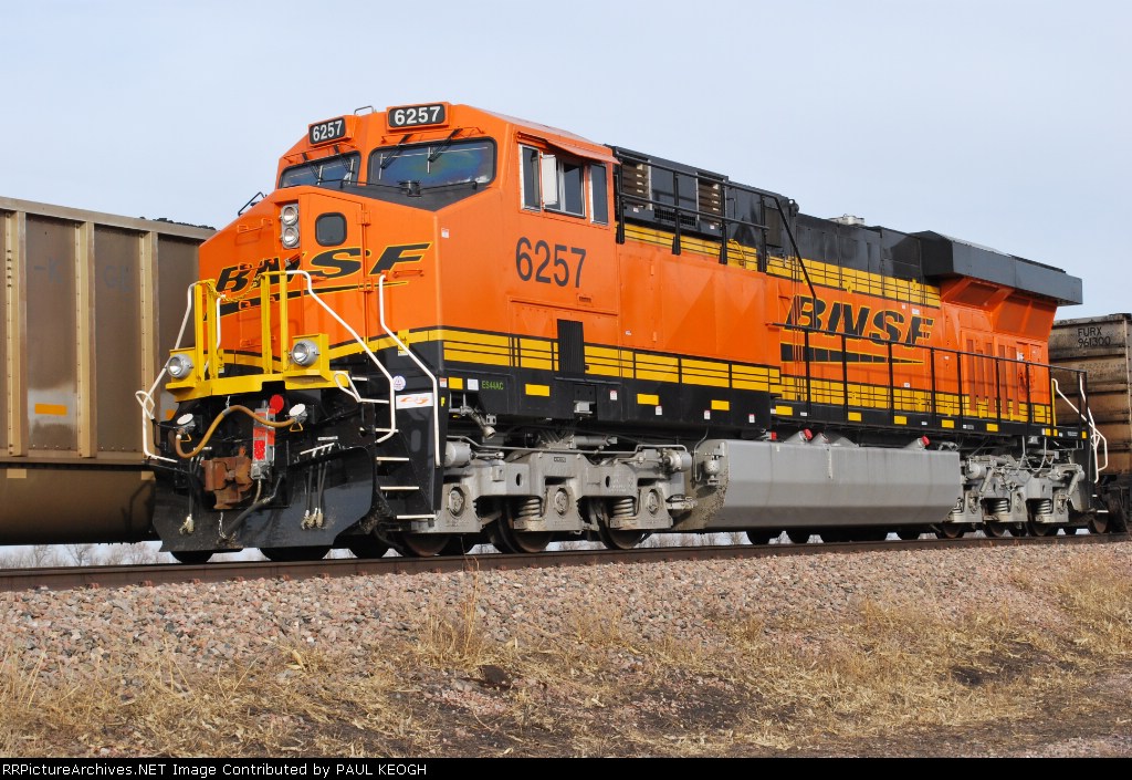 BNSF 6257 from a distance shot showing the End of train Device attached to the knuckle/coupler.